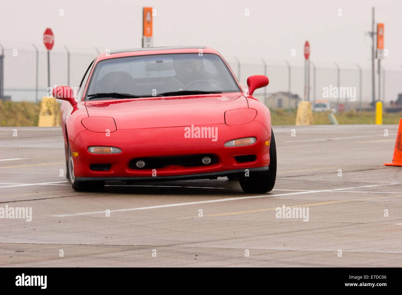 A red sports car in an autocross race at a regional Sports Car Club of ...