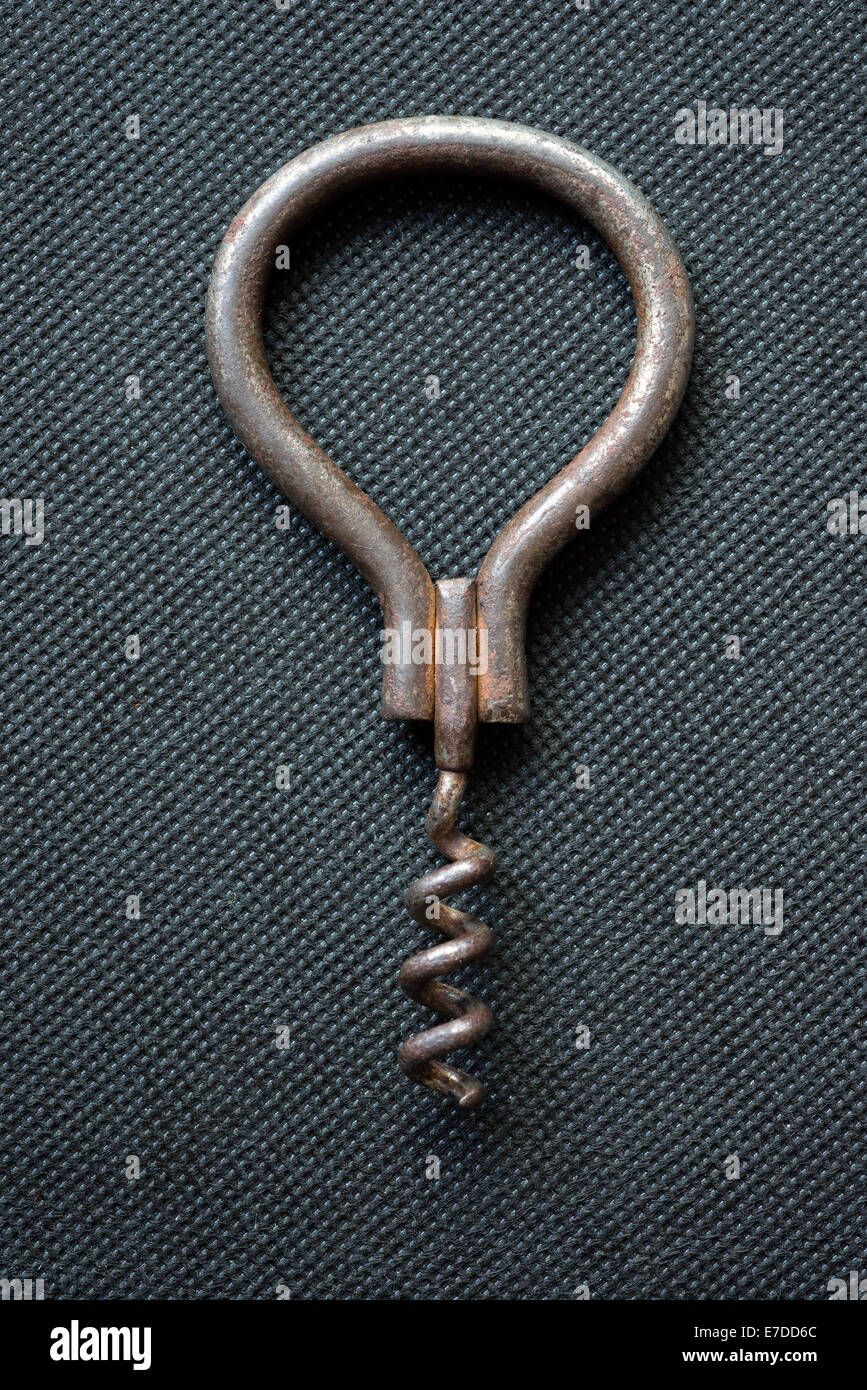 vintage rusty corkscrew on the dark background Stock Photo - Alamy