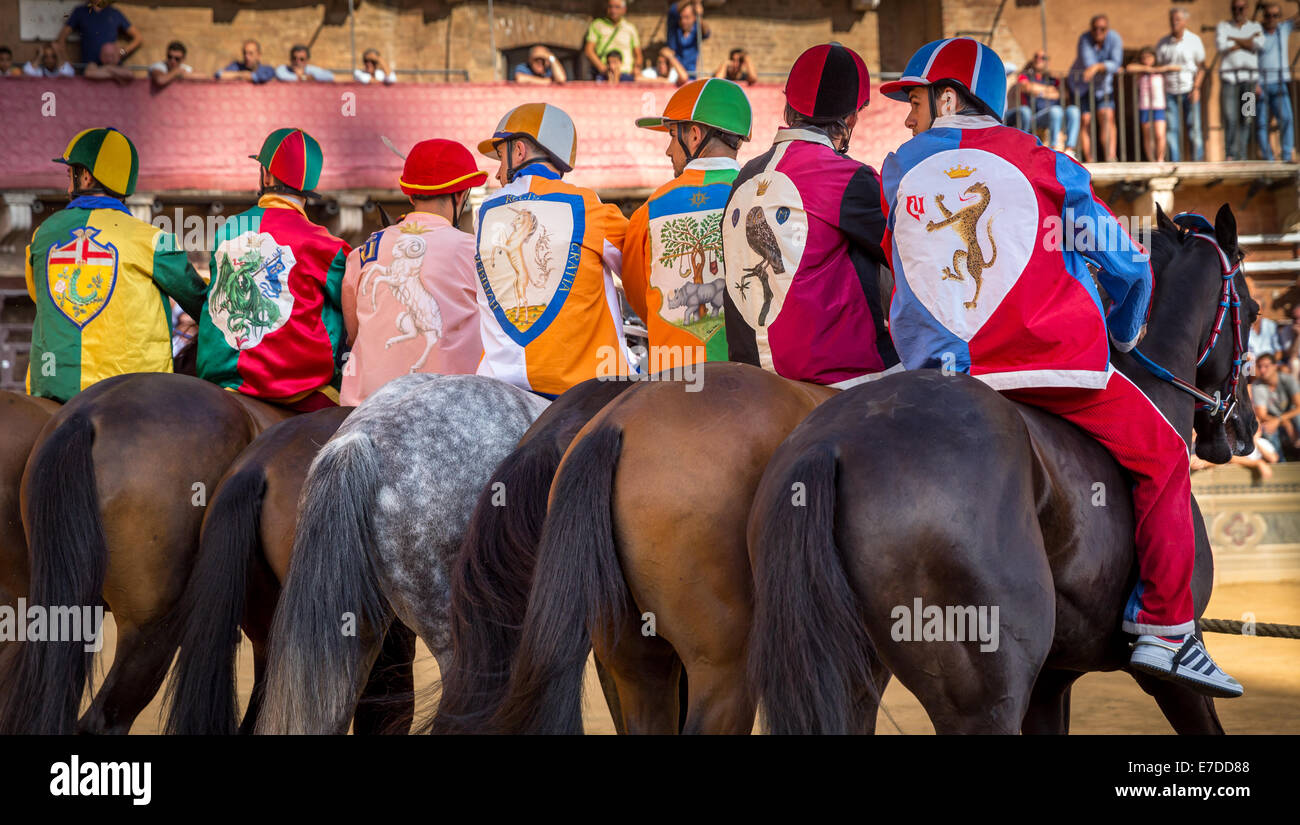 Jockeys waiting for the start of Palio di Siena horse race on Piazza ...