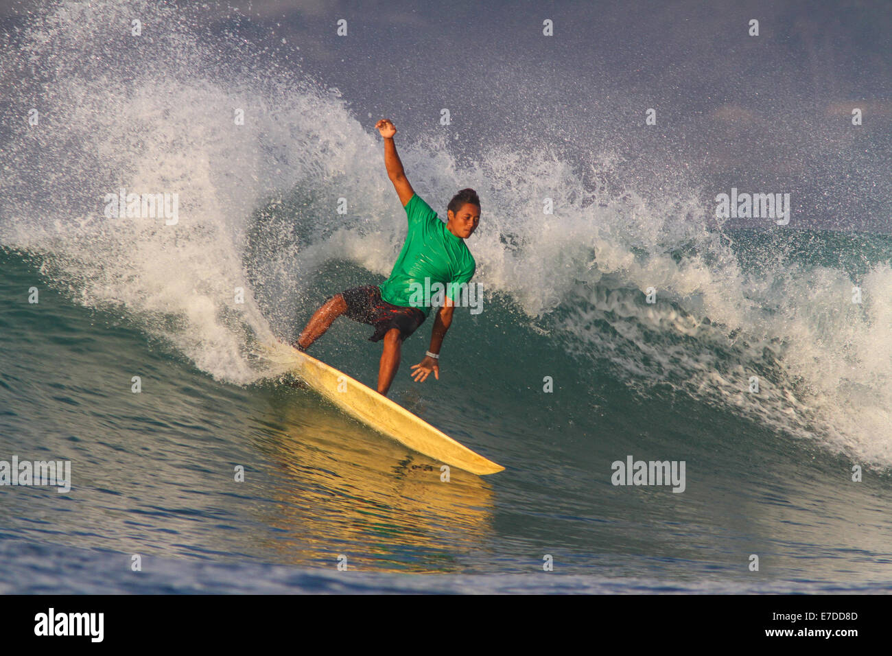 Surfing a wave Stock Photo - Alamy