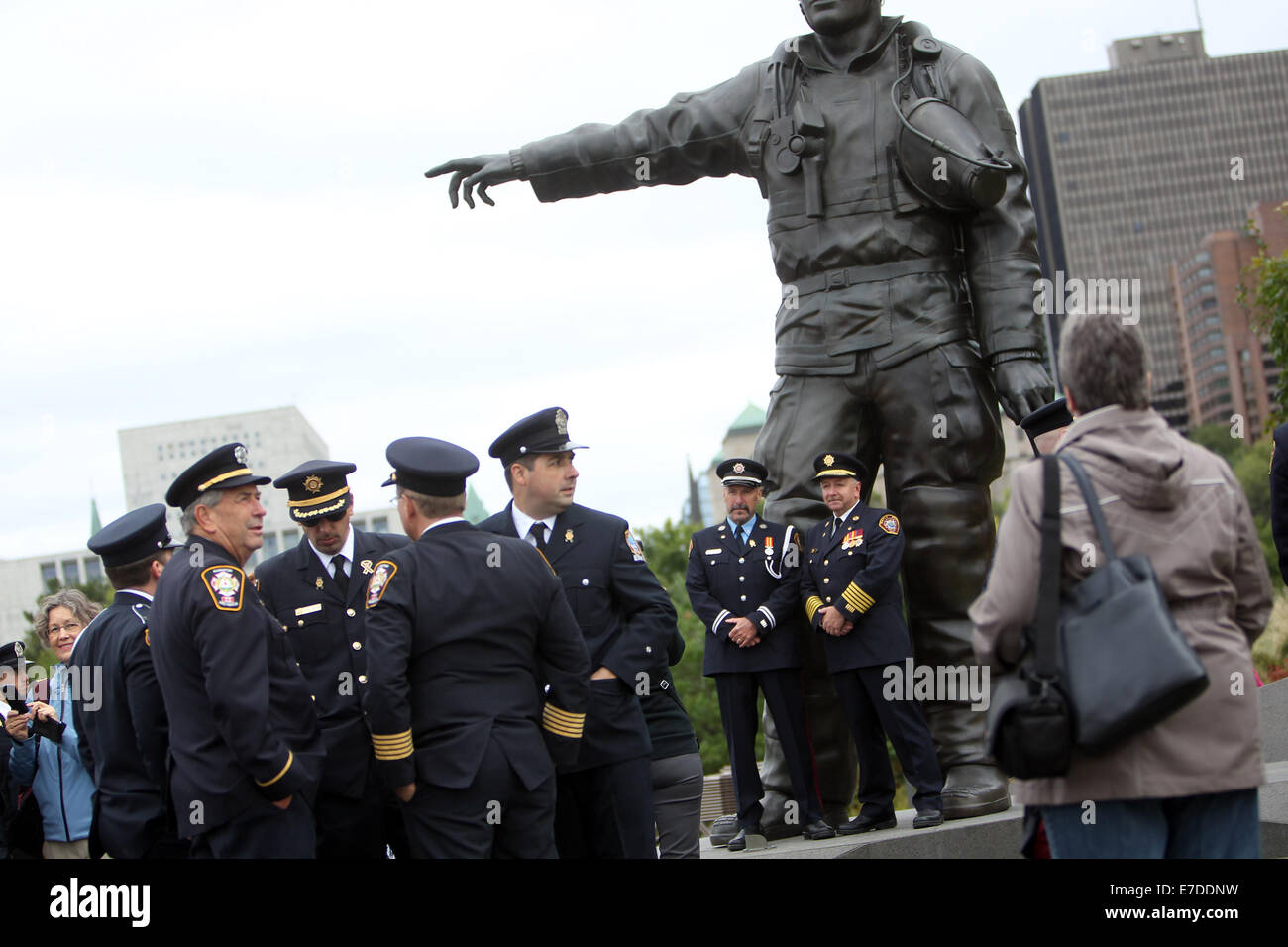 Ottawa, Canada. 14th Sep, 2014. Firefighters look on at the Canadian ...