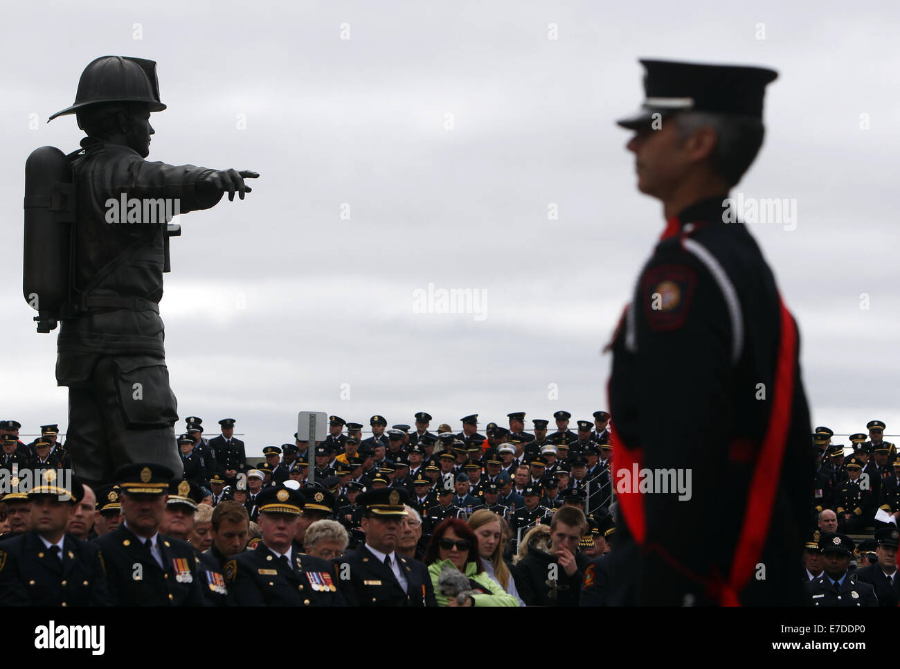Ottawa, Canada. 14th Sep, 2014. Firefighters look on at the Canadian ...