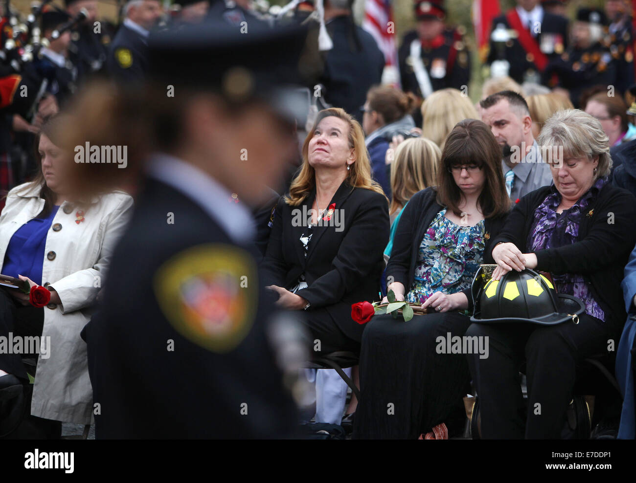 Ottawa, Canada. 14th Sep, 2014. Family members fight back tears at the ...