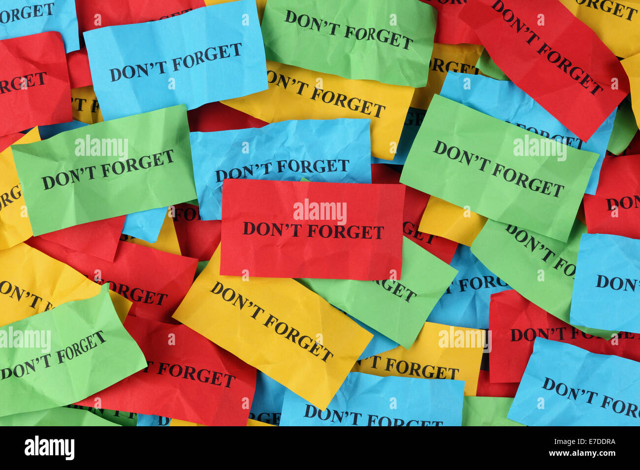 Crumpled colorful paper notes with phrase "Don't forget Stock Photo - Alamy