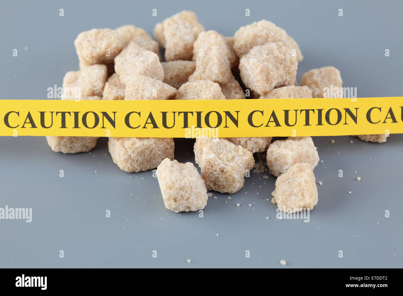 Dangers of Sugar concept. Sugar free concept. Sugar heap with caution ...