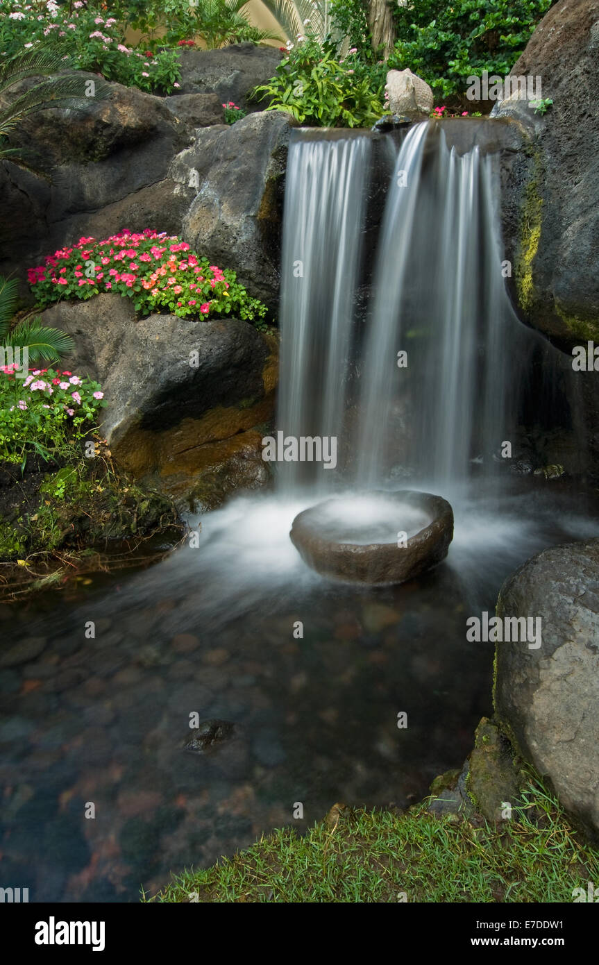 A peaceful waterfall creates a meditative mood in a Japanese garden ...