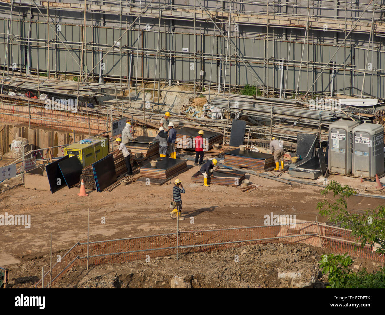 Foreign migrant workers at construction site in Singapore Stock Photo ...