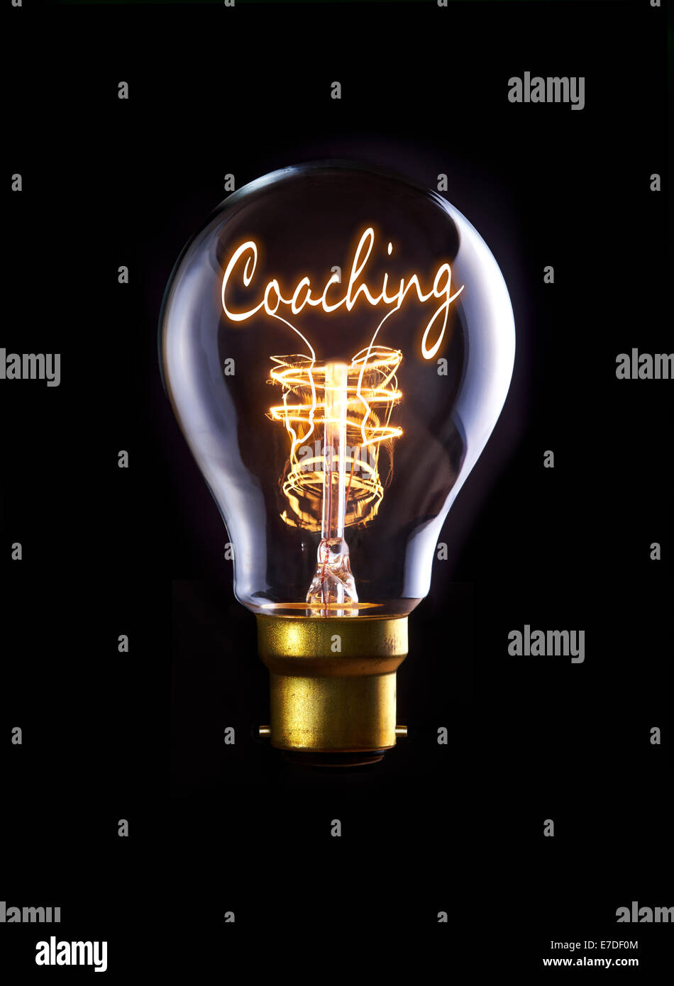 Coaching concept in a filament lightbulb Stock Photo - Alamy