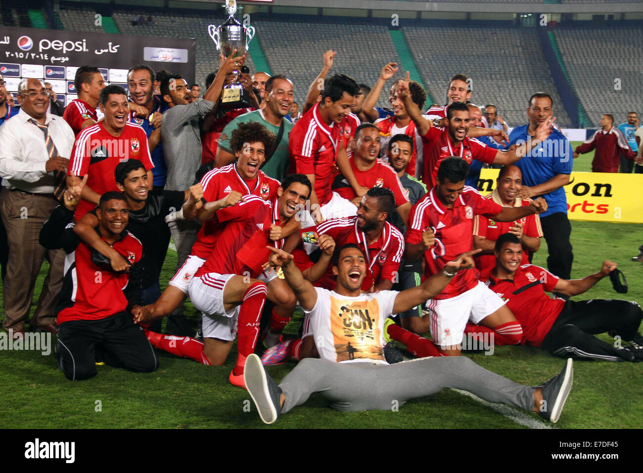 Al Ahly players celebrate with their trophy after winning their ...
