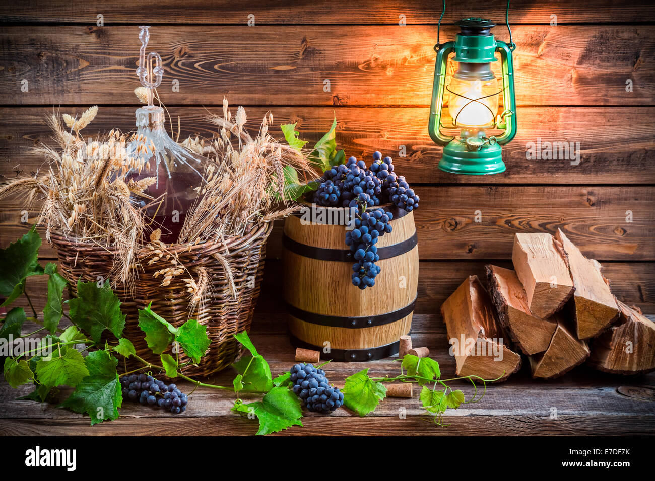 Grapes and red wine in a demijohn Stock Photo - Alamy