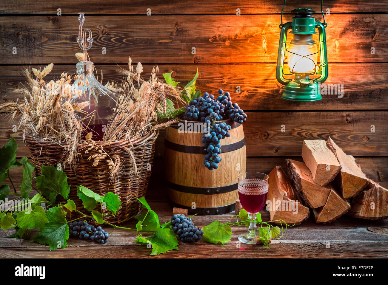 Grapes and red wine in a demijohn Stock Photo - Alamy