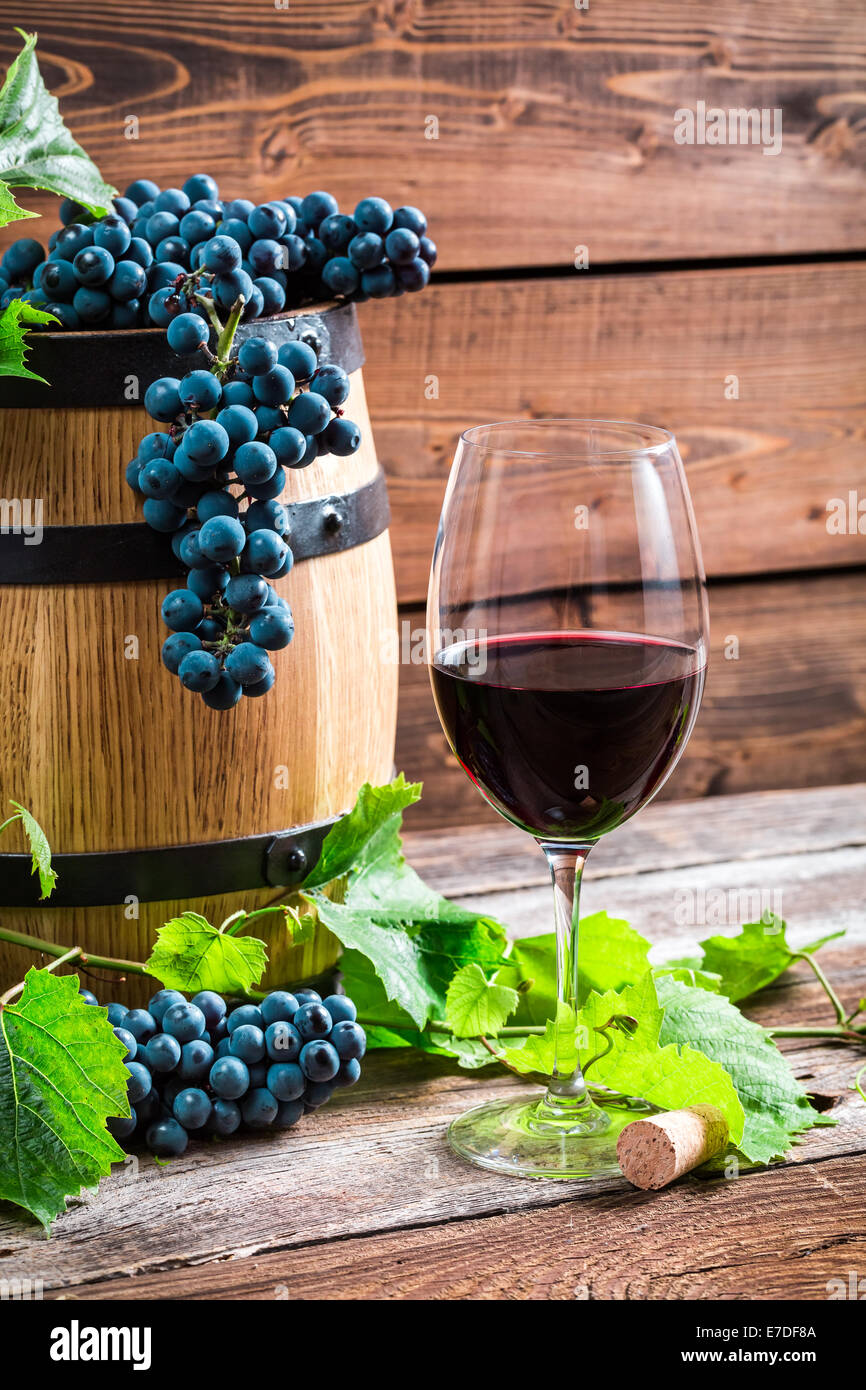 Red grapes and a glass of red wine Stock Photo - Alamy