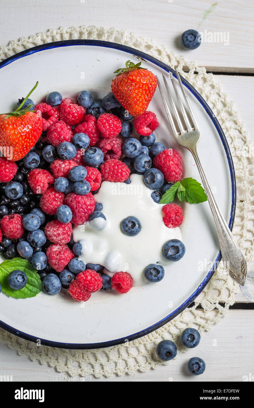 Berry fruits with cream Stock Photo - Alamy