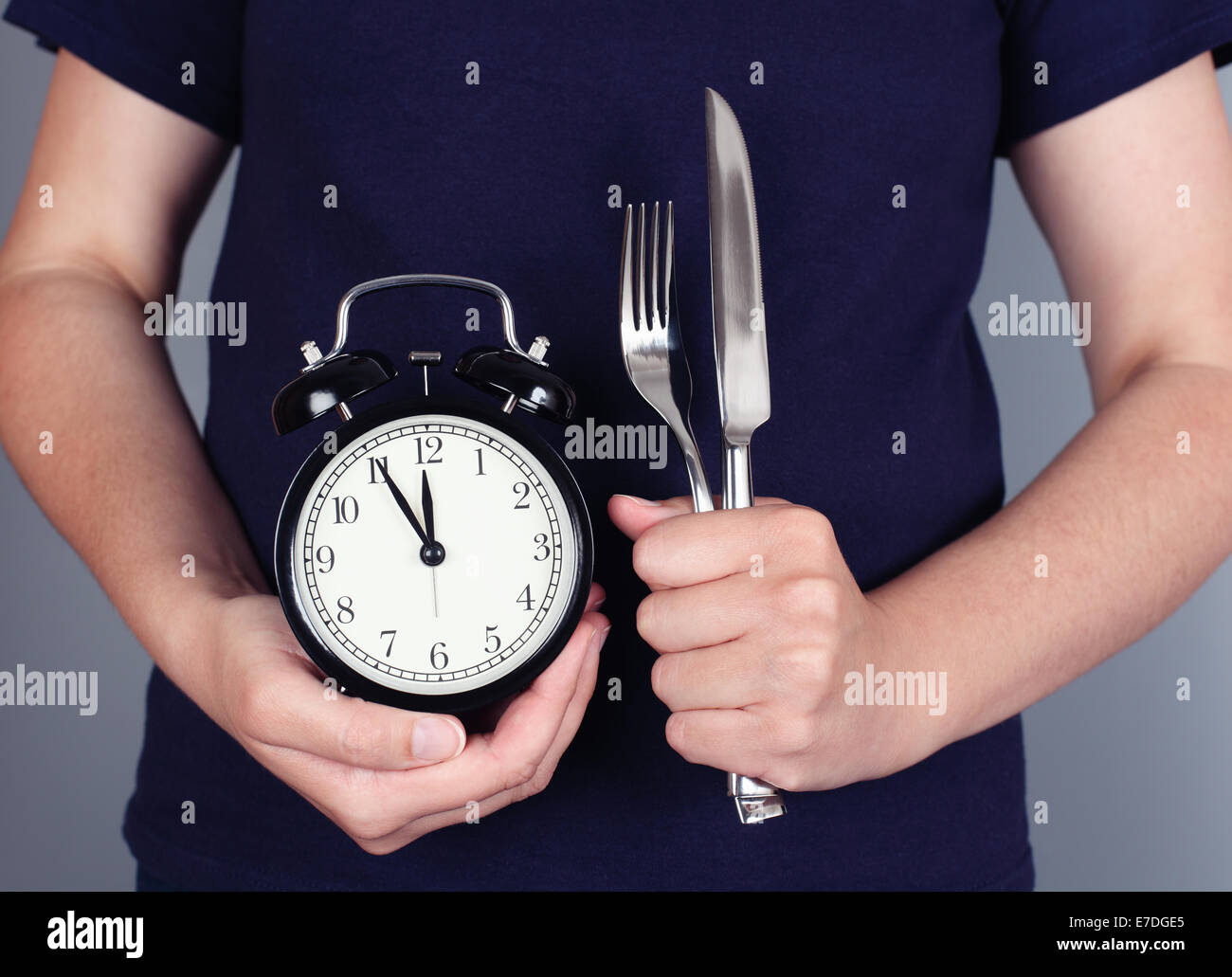 Clock hands knife and fork hi-res stock photography and images - Alamy