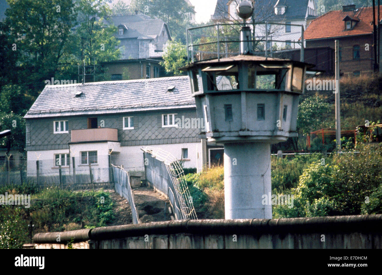 The inner German border with wall, border fence and guard tower between ...
