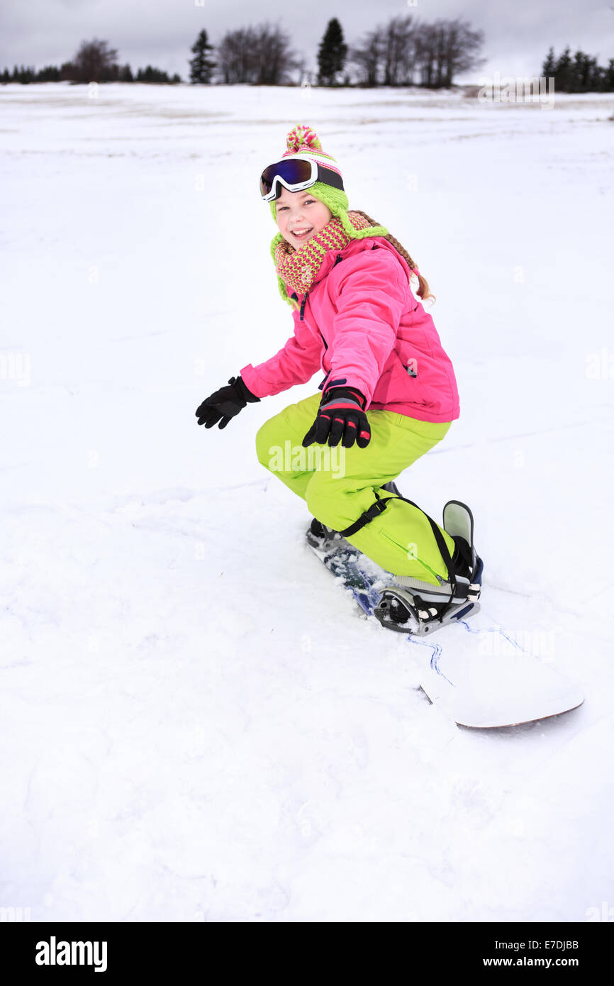 a teenage girl snowboarding in the Alps Stock Photo - Alamy