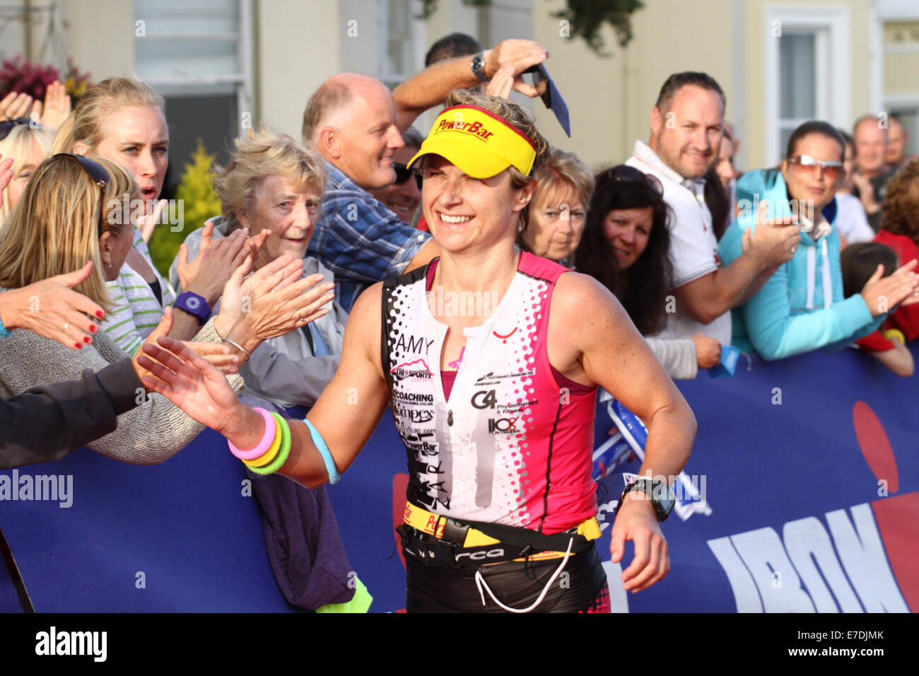 Tenby, Pembrokeshire, Wales, UK, 14th Sep, 2014. Runners crossing the ...