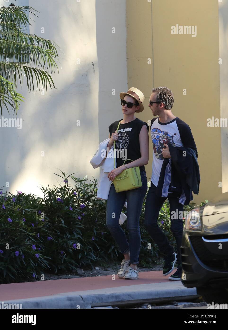 Anne Hathaway wearing a Ramones t-shirt while husband Adam Shulman ...