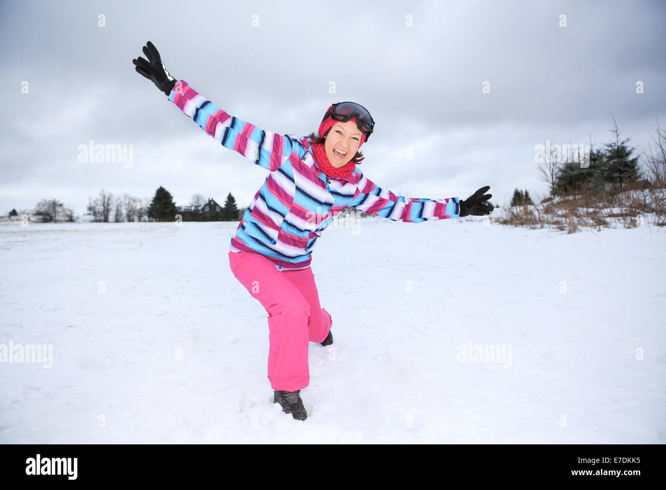a woman snowboarding in the Alps Stock Photo - Alamy
