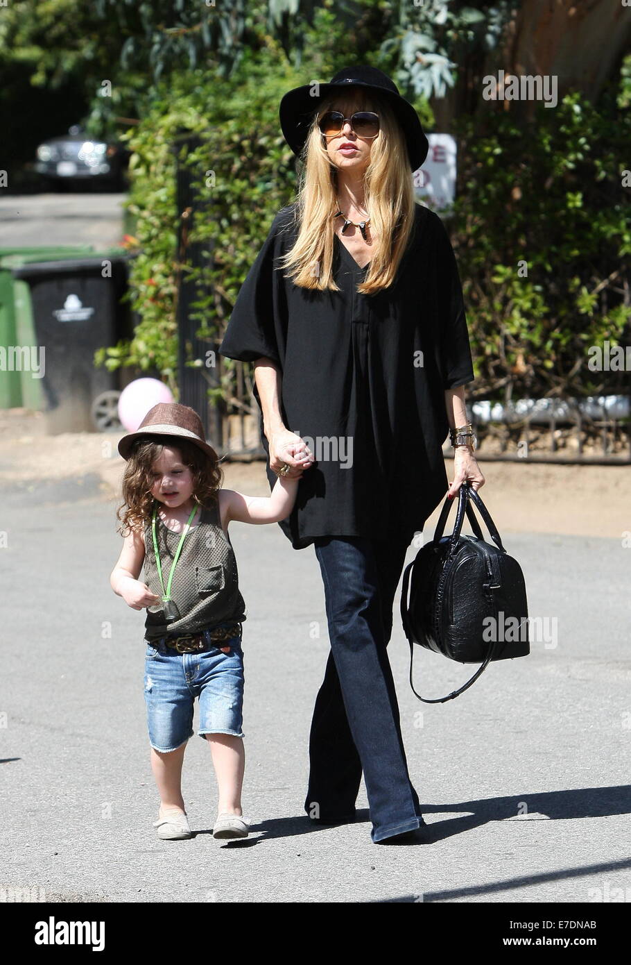 Rachel Zoe dressed all in black wearing a wide brimmed floppy hat and ...