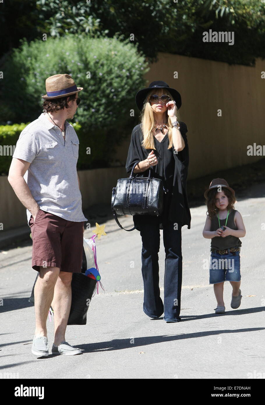 Rachel Zoe dressed all in black wearing a wide brimmed floppy hat and ...