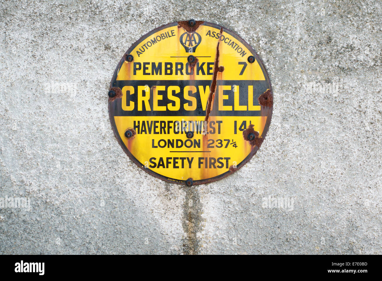 An old AA (Automobile Association) yellow sign at Cresswell Quay ...