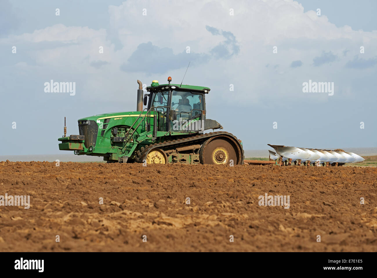 John Deere 8345 RT & plough Stock Photo - Alamy