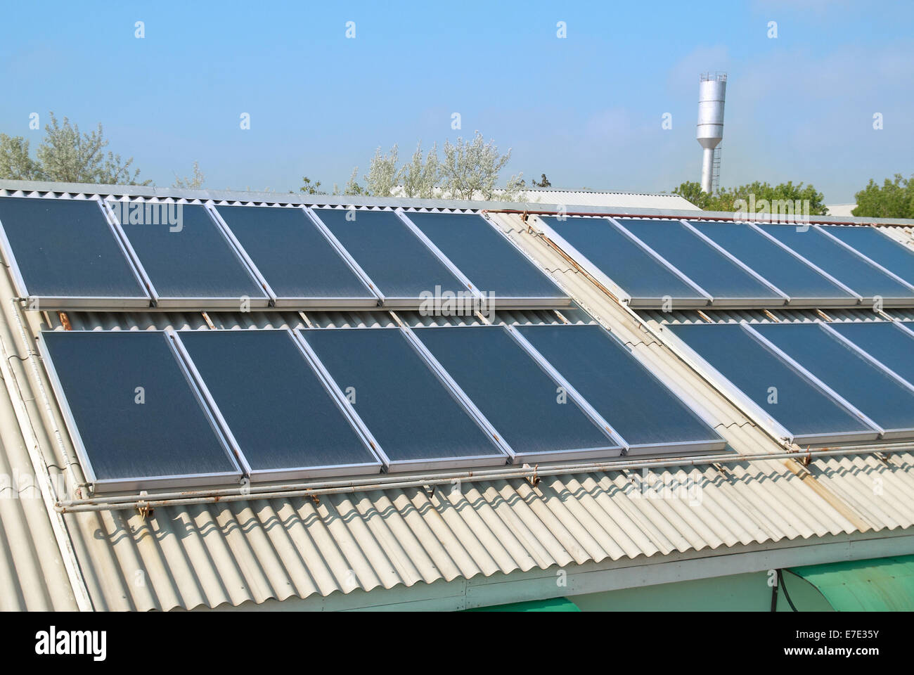 Solar water heating system on the red roof. Gelio panels Stock Photo ...