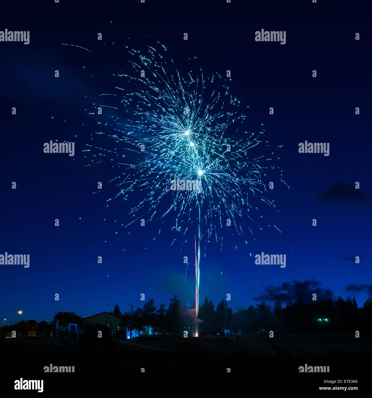Blue colorful fireworks on night sky background Stock Photo - Alamy