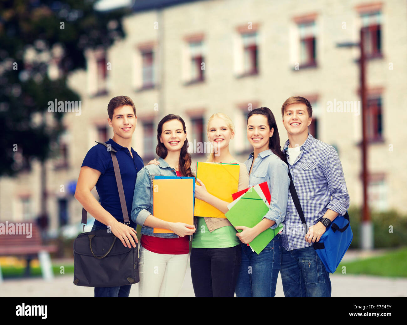 group of smiling students standing Stock Photo - Alamy