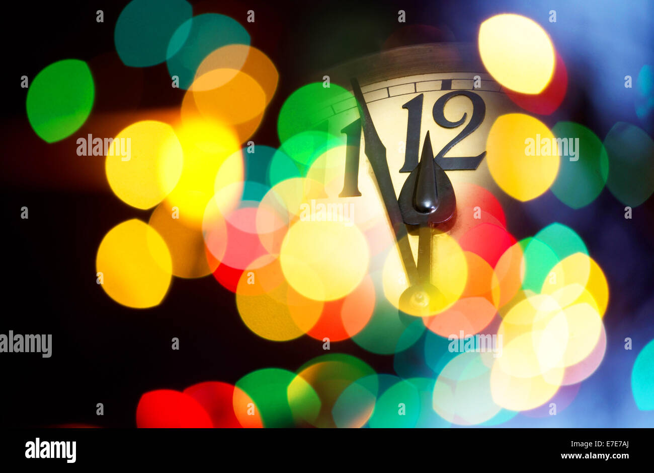 face of new year clock with colored decoration Stock Photo - Alamy