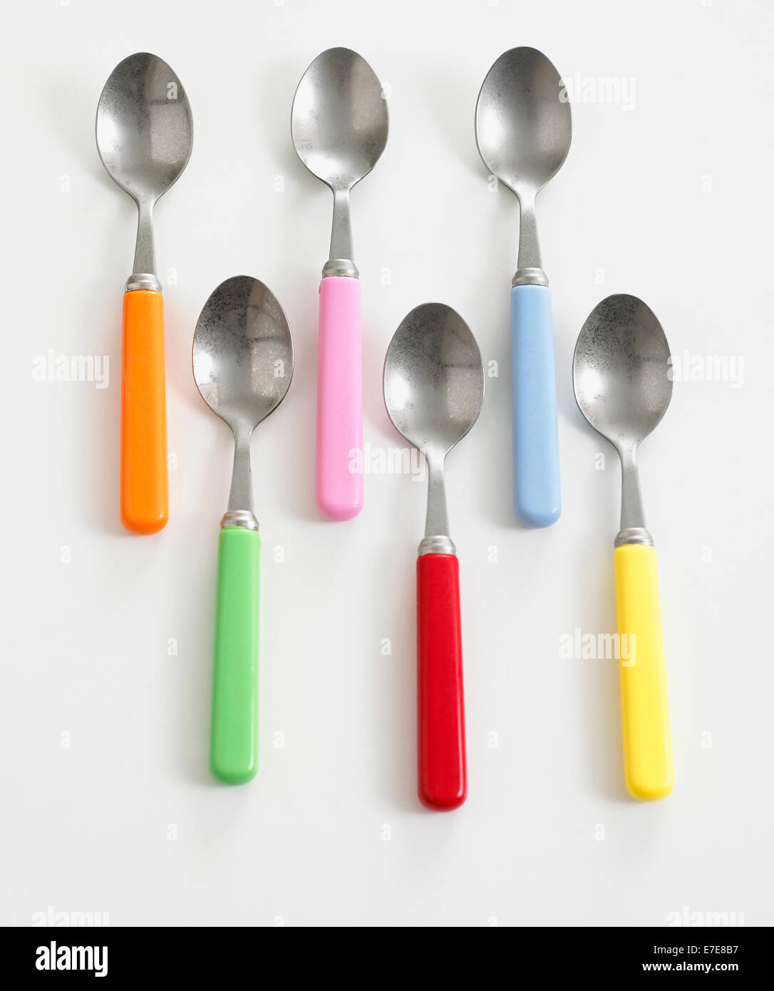 Teaspoons with colored handles Stock Photo - Alamy