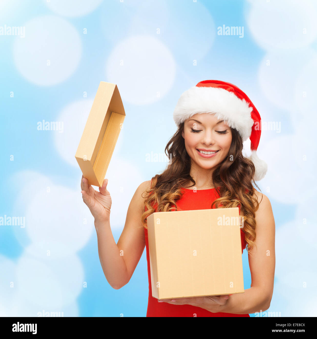 smiling woman in santa helper hat with gift box Stock Photo - Alamy