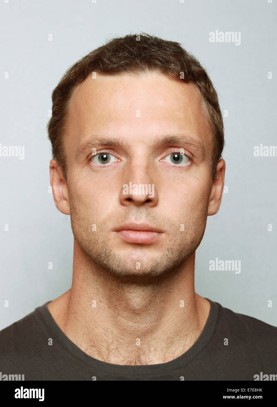 Young Caucasian man closeup portrait. Headshot on gray Stock Photo - Alamy