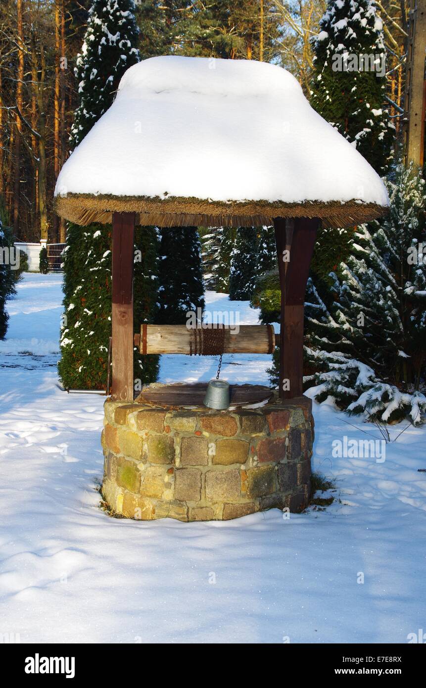old well on a forest background in winter scenery Stock Photo - Alamy