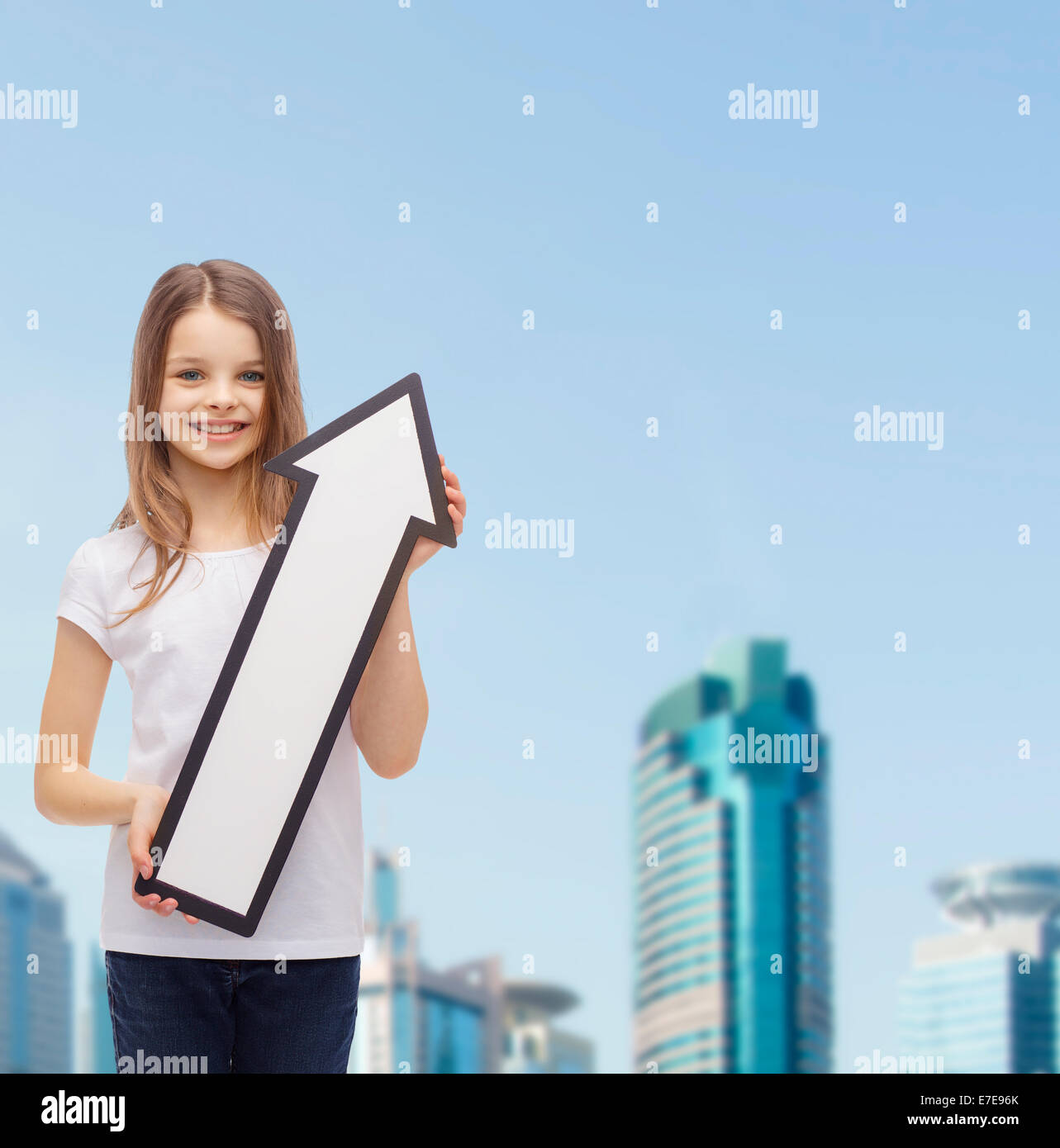 smiling little girl with blank arrow pointing up Stock Photo - Alamy