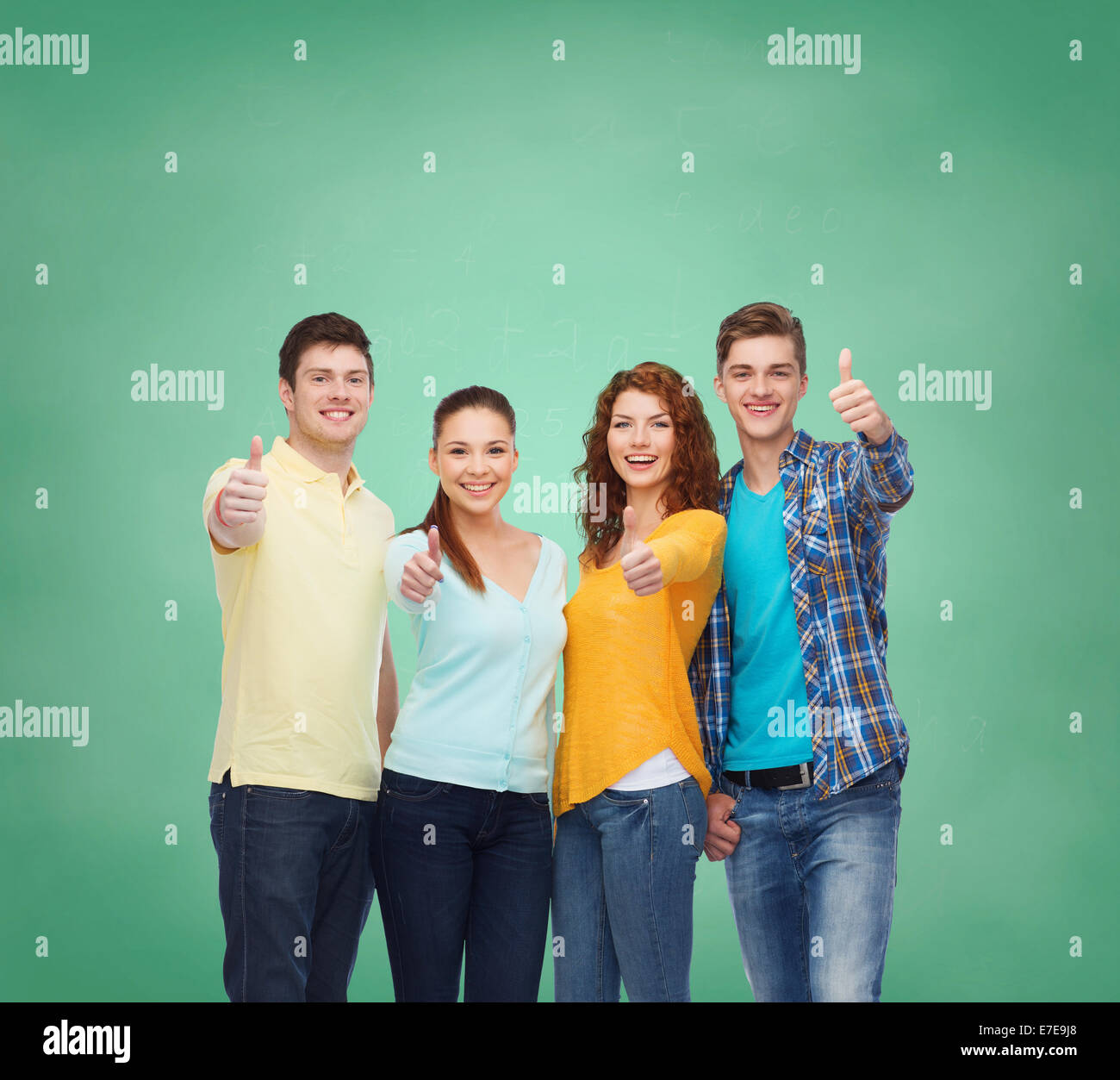 group of smiling teenagers over green board Stock Photo - Alamy