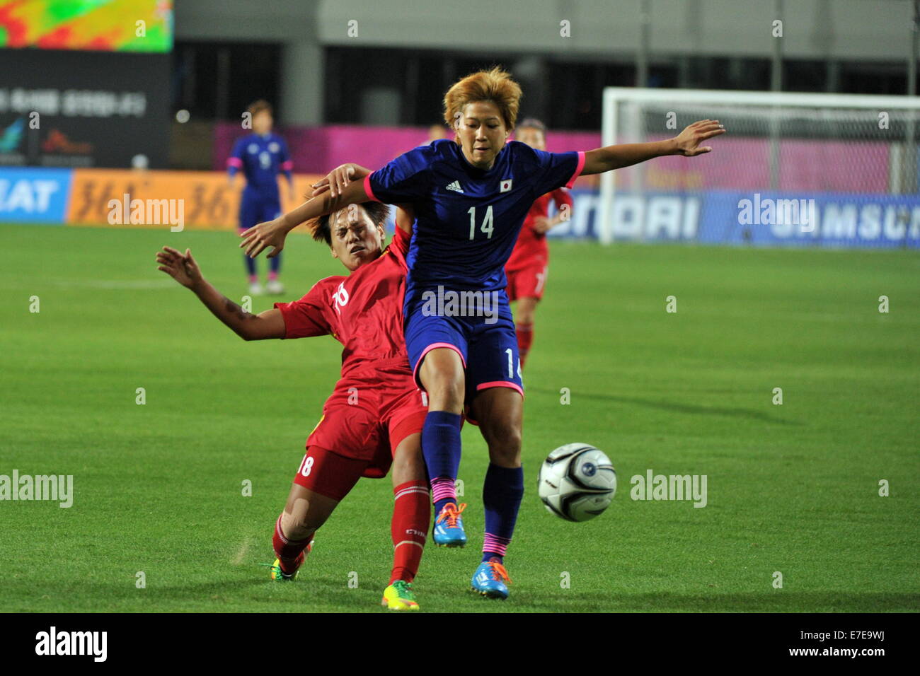 Incheon, South Korea. 15th Sep, 2014. Han Peng (L) of China vies with ...