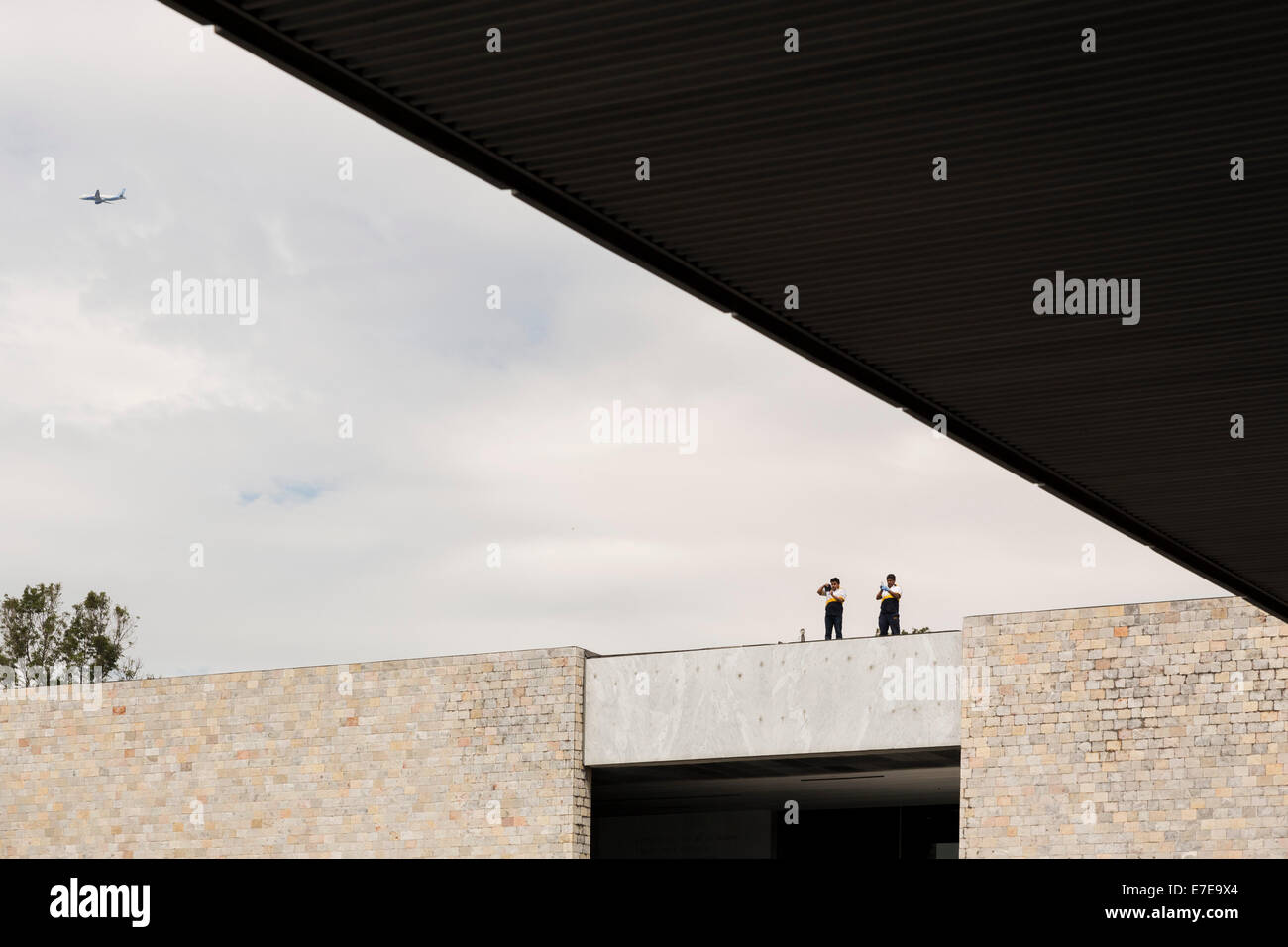 Man on roof hi-res stock photography and images - Alamy