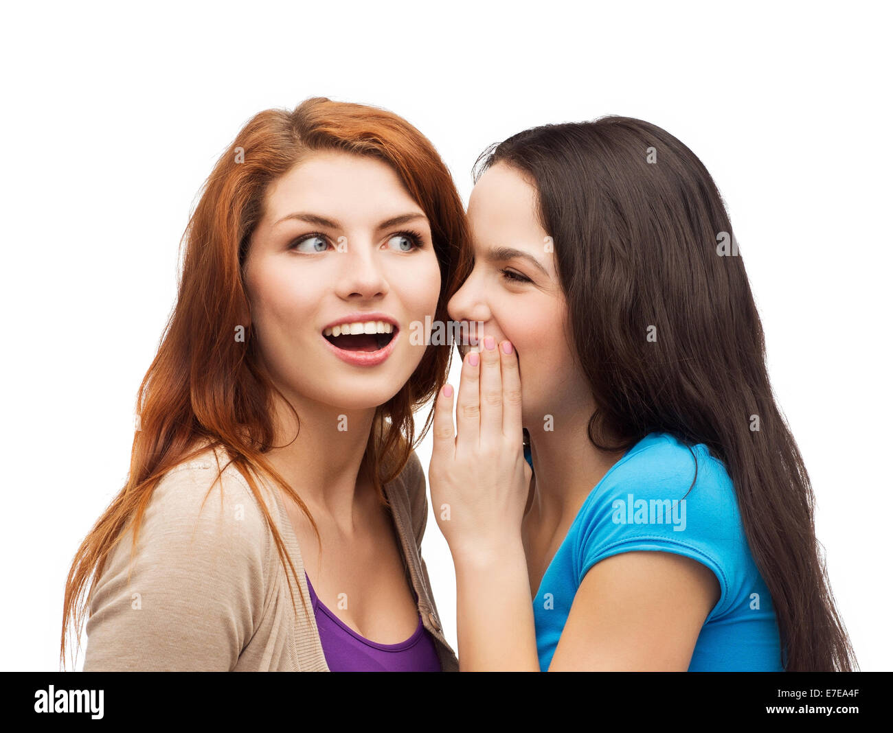 one girl telling another secret Stock Photo - Alamy