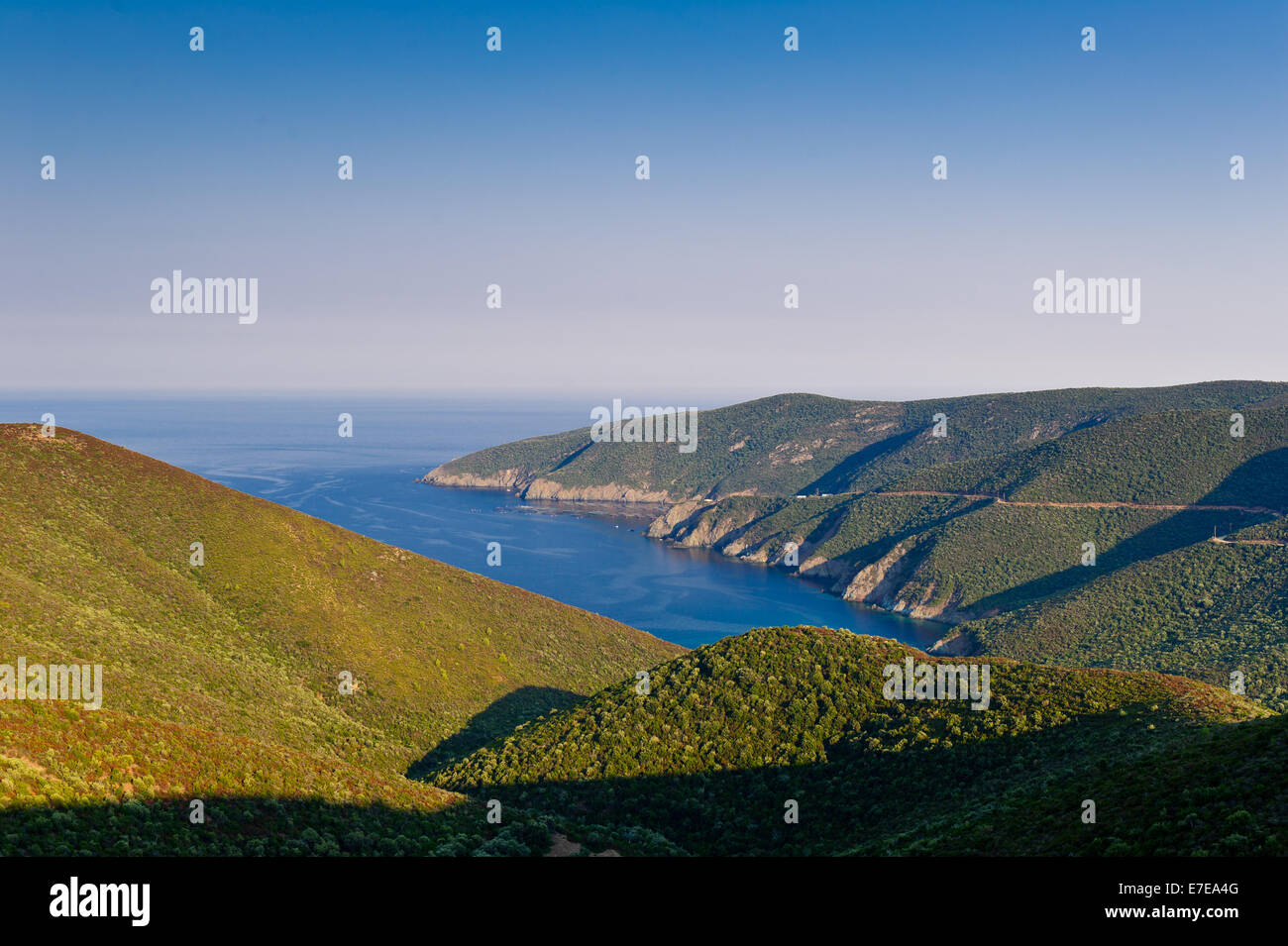Rocky bay at sunset Stock Photo - Alamy