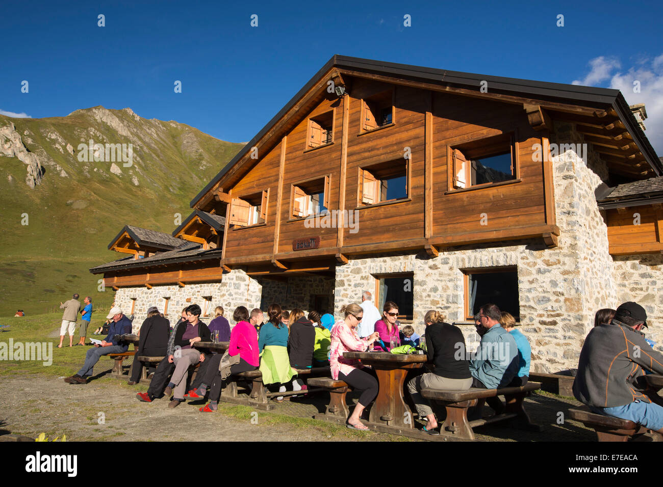 Walkers doing the Tour Du Mont Blanc outside the Bonatti Hut opposite ...
