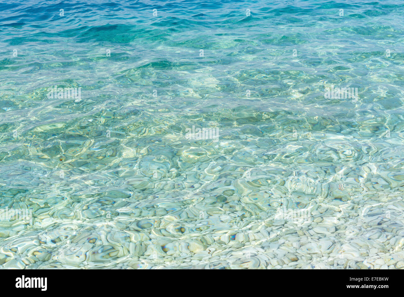 Sea surface with transparent water and stones on bottom. Nature ...
