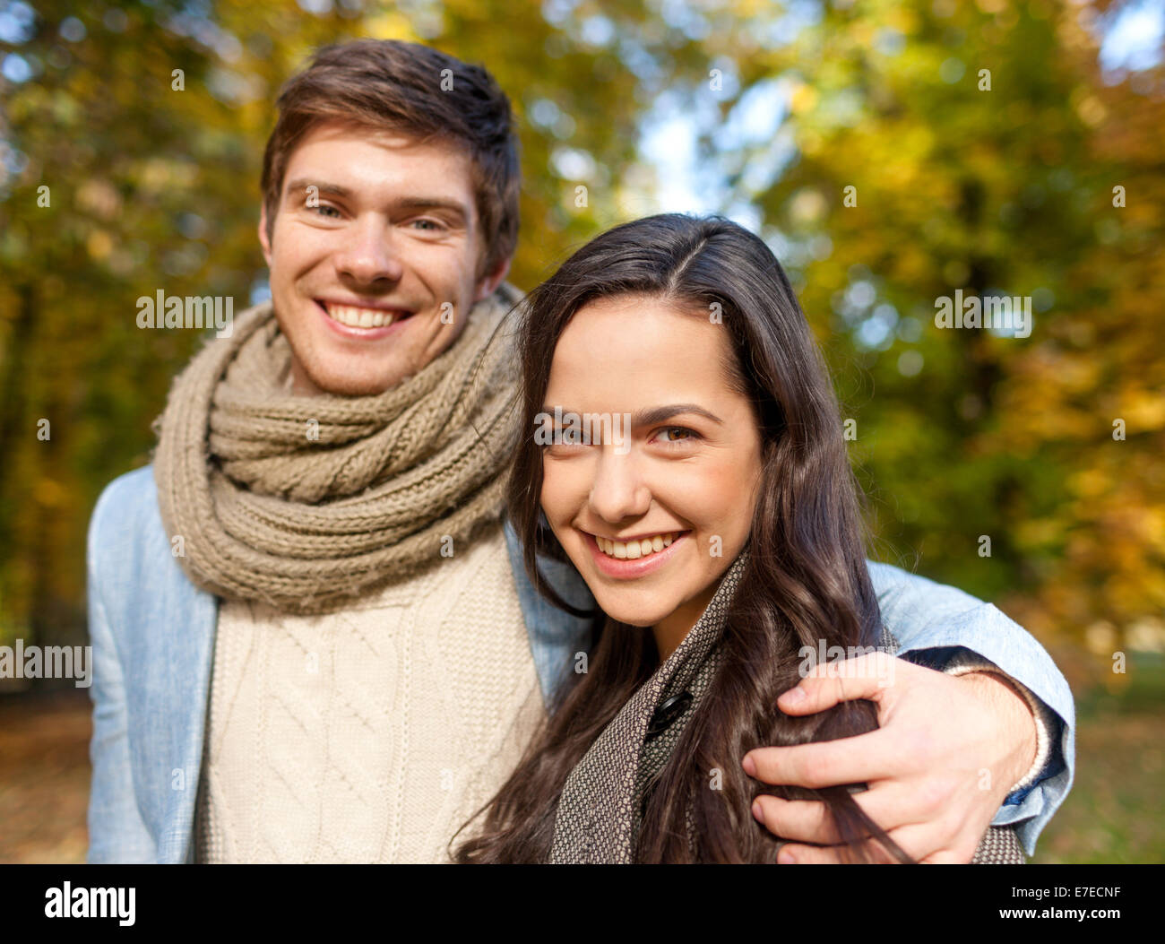 smiling couple hugging in autumn park Stock Photo - Alamy