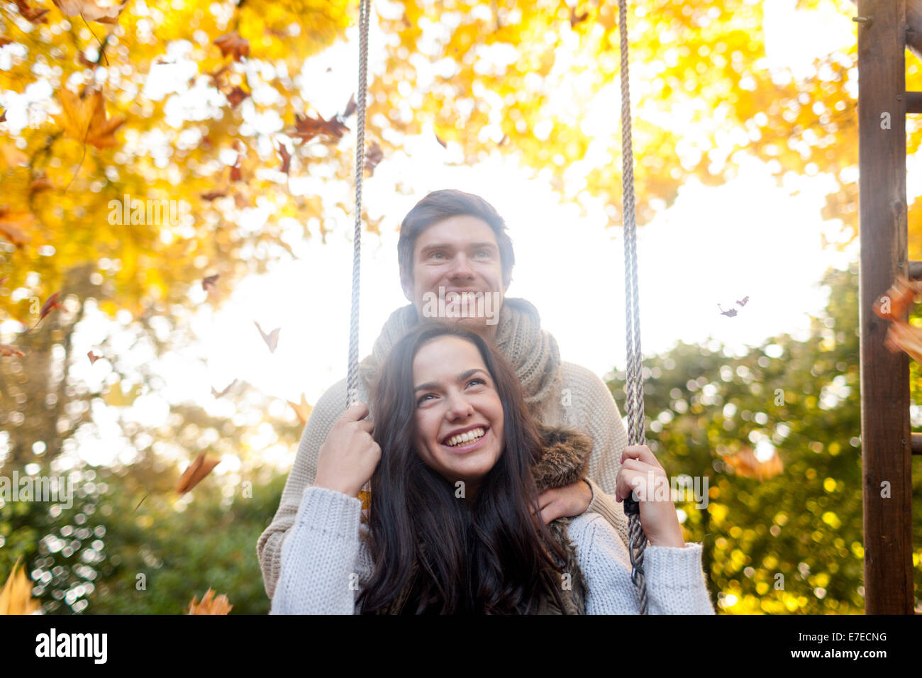smiling couple hugging in autumn park Stock Photo - Alamy