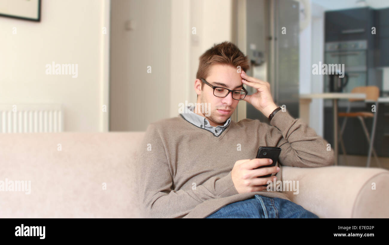 Young man reading text hi-res stock photography and images - Alamy