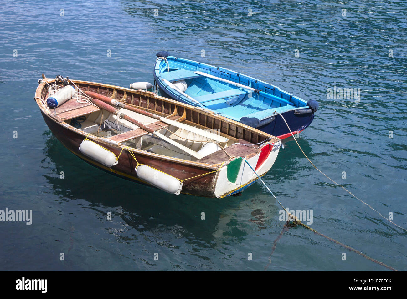 Small wooden boats, docked in the port of Portofino, Italy Stock Photo ...