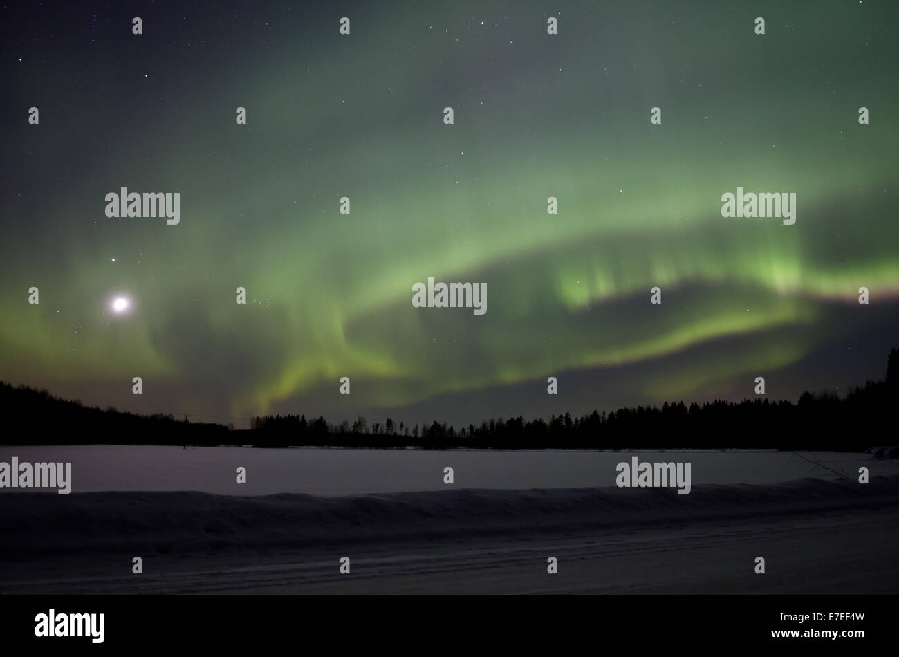 Aurora borealis at field Stock Photo - Alamy