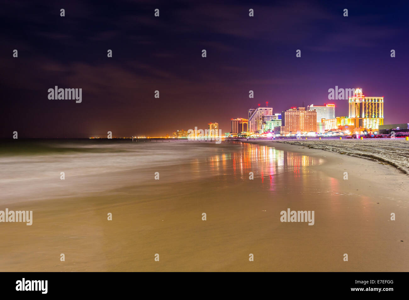 The skyline and Atlantic Ocean at night in Atlantic City, New Jersey ...
