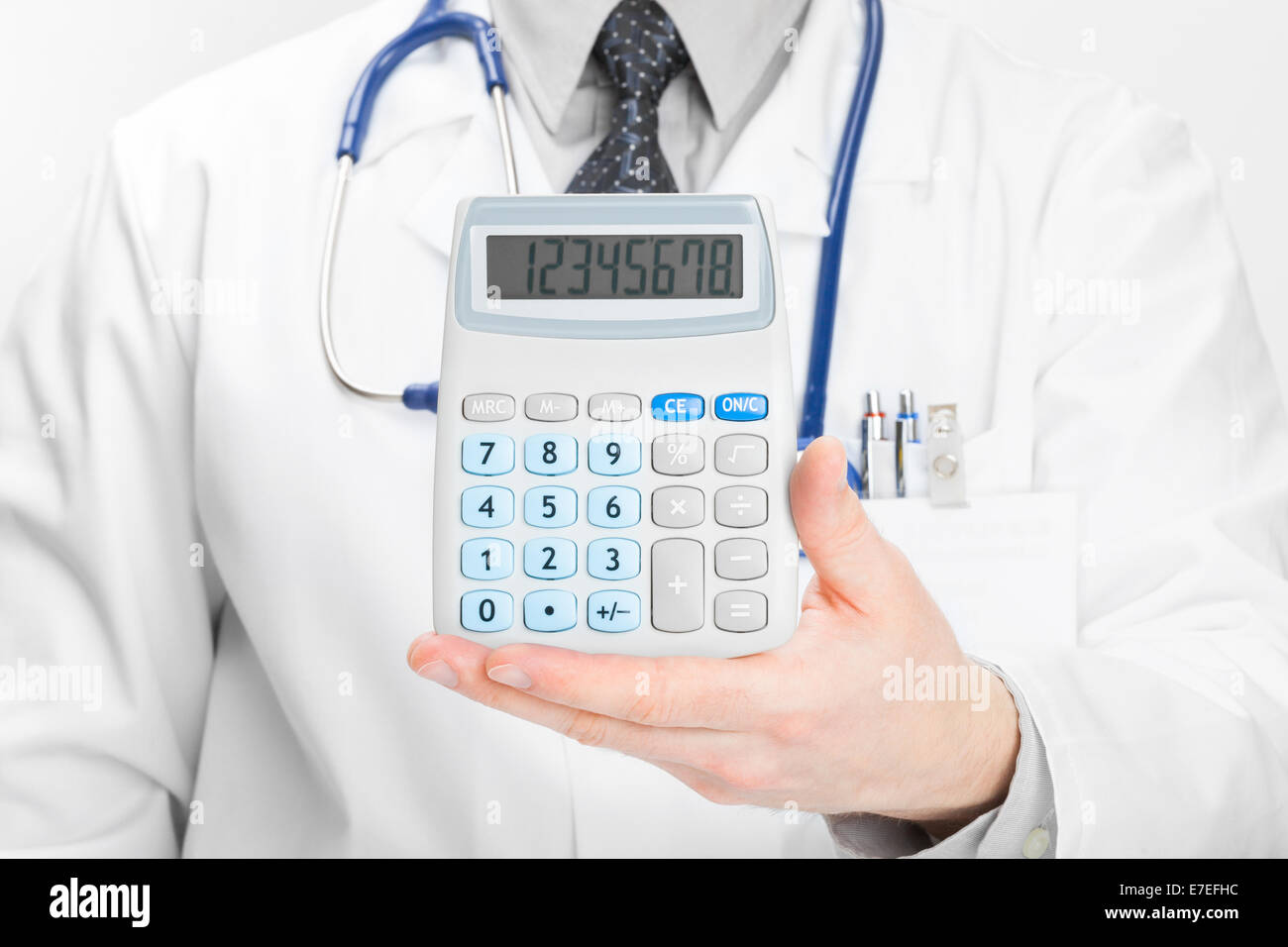 Medical doctor with calculator in his hand - heath care concept Stock ...